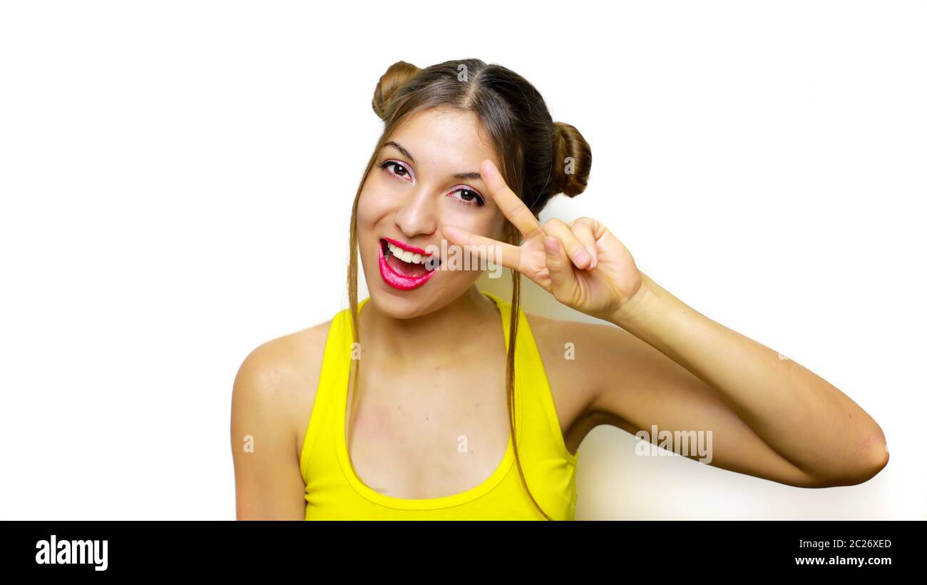 Happy beautiful girl showing peace sign on her eye on white background ...