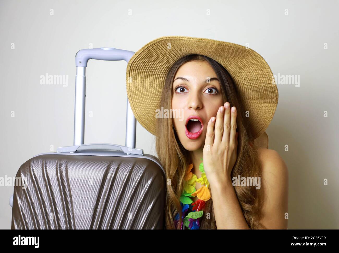 Portrait of surprised girl with hat before traveling Stock Photo - Alamy