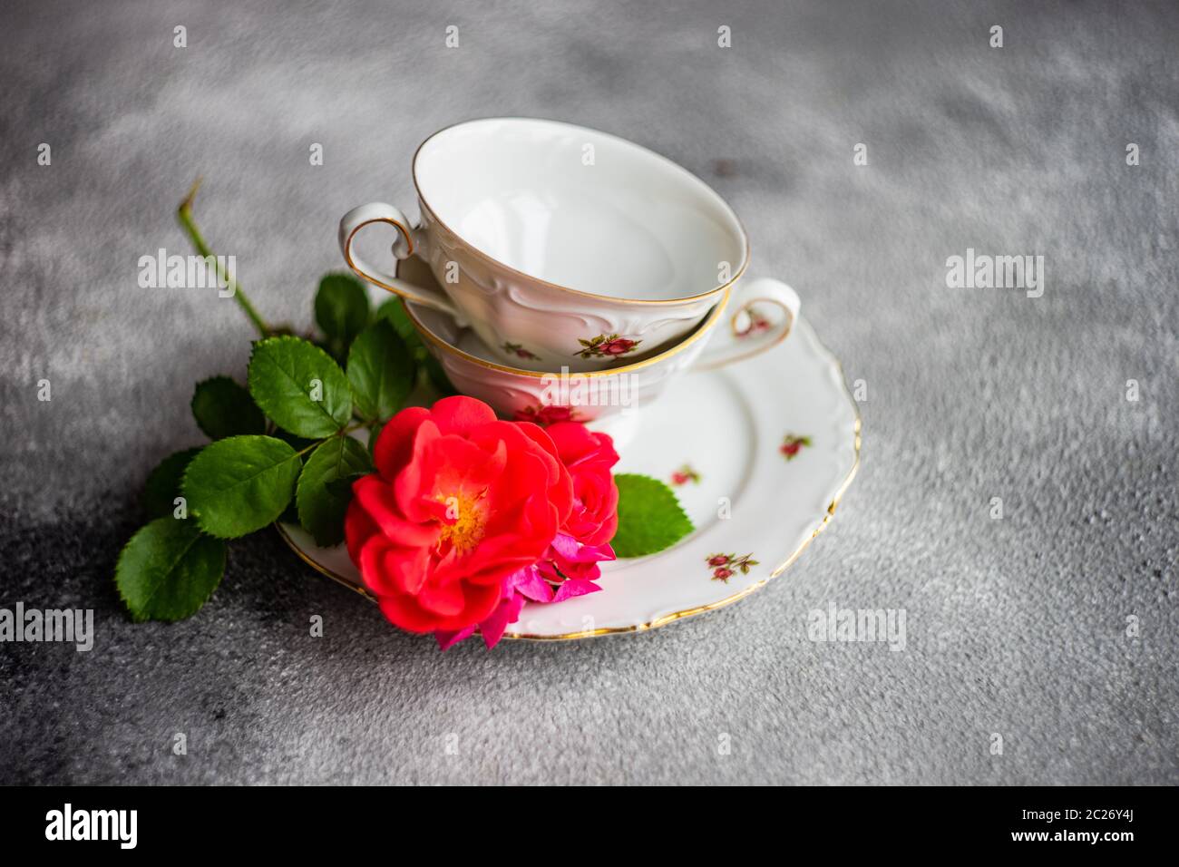 Tea set with red roses Stock Photo - Alamy