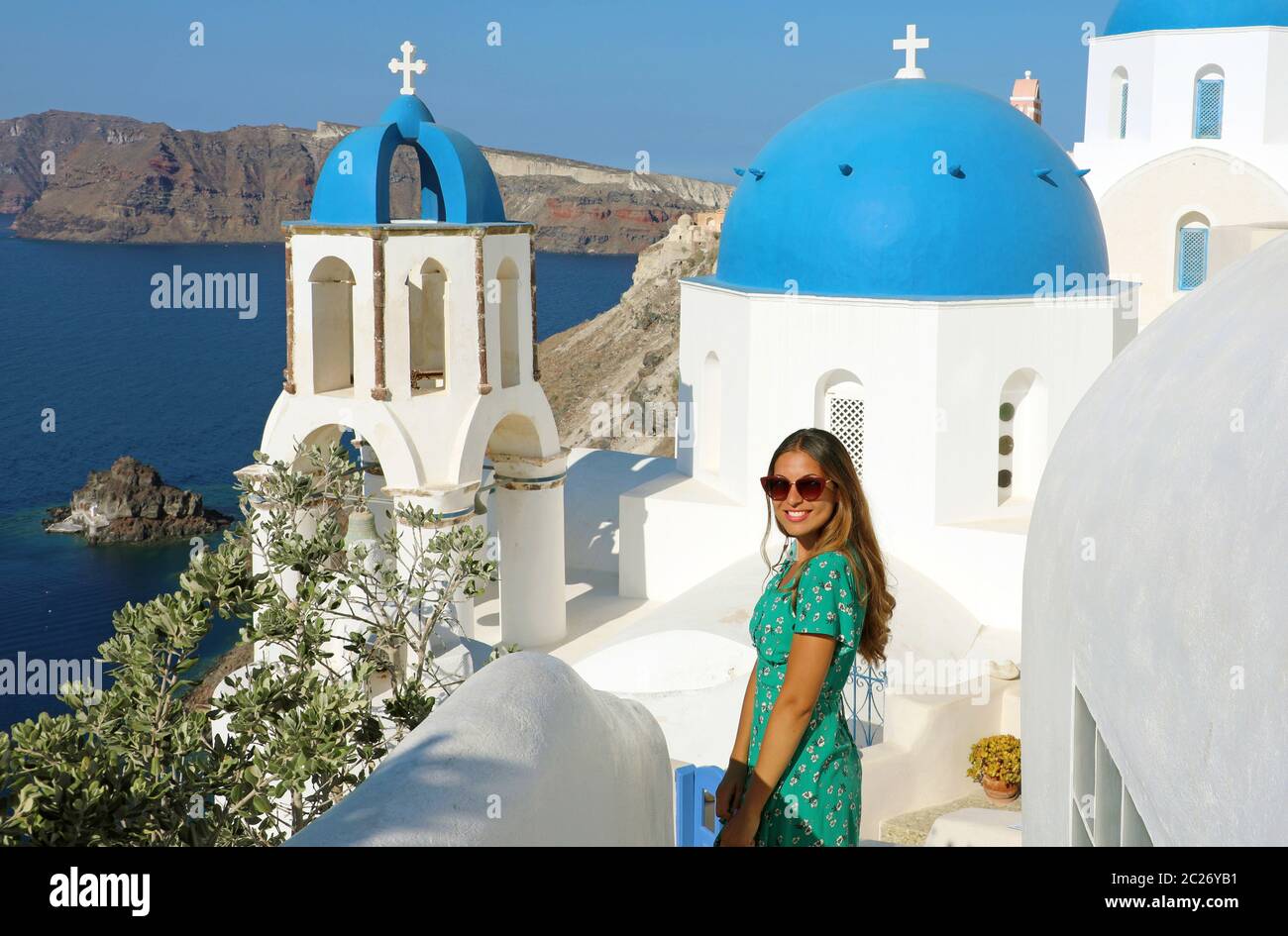 Happy young fashion model in Santorini. Beautiful tanned woman with ...