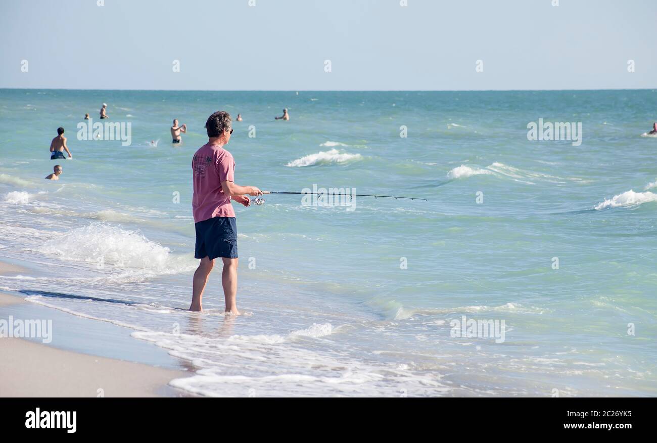 Man with rod and line fishing in sea Stock Photo - Alamy