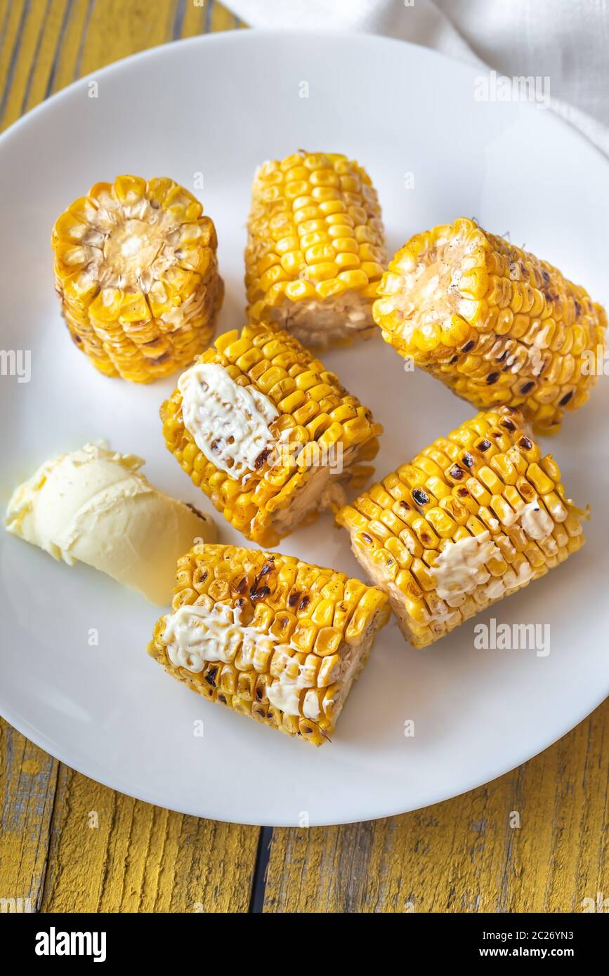 Grilled corn on the white plate Stock Photo - Alamy