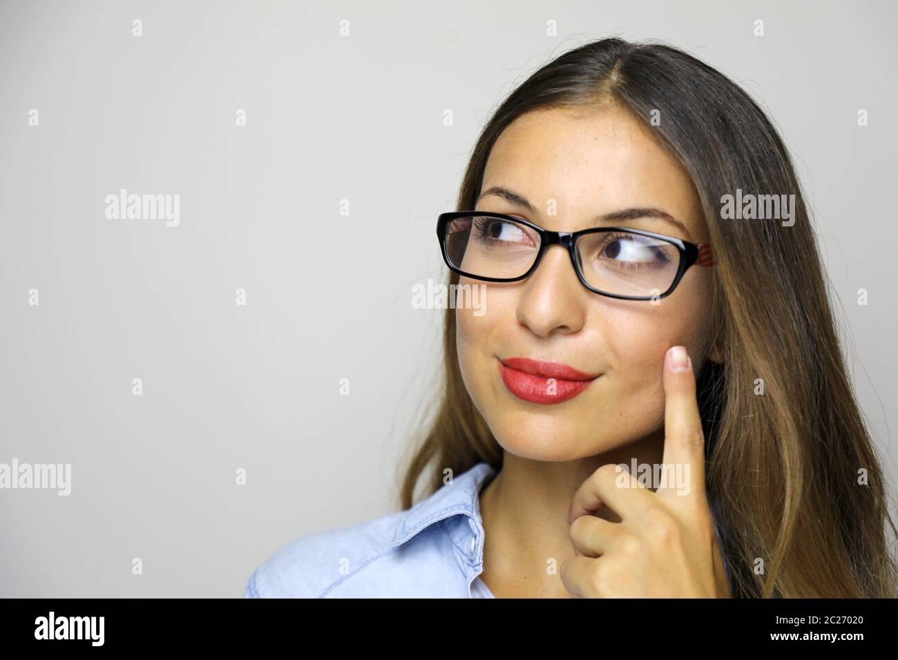 Finger on cheek hi-res stock photography and images - Alamy