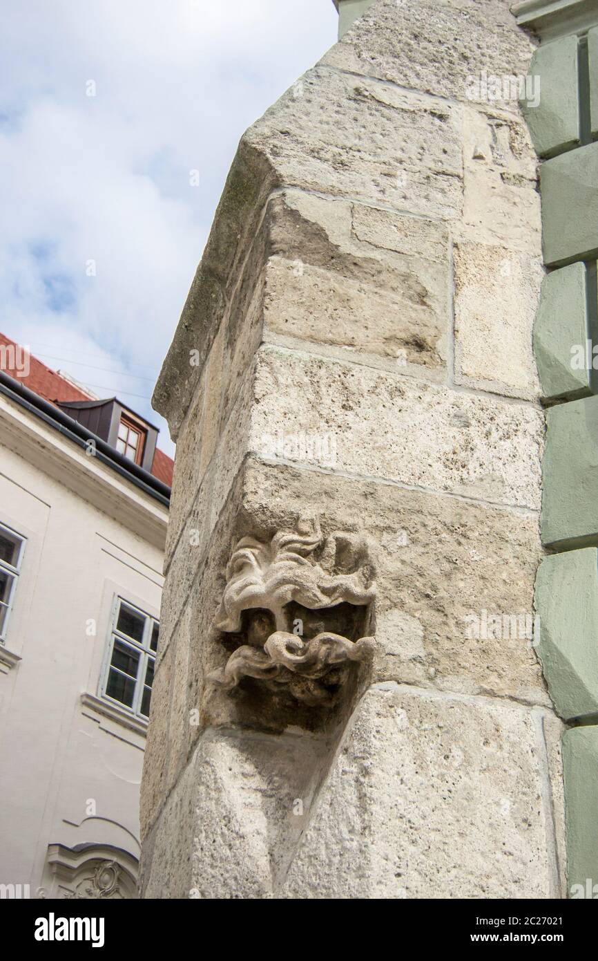 Sculpture of a face in stone in the ancient city of Bratislava ...