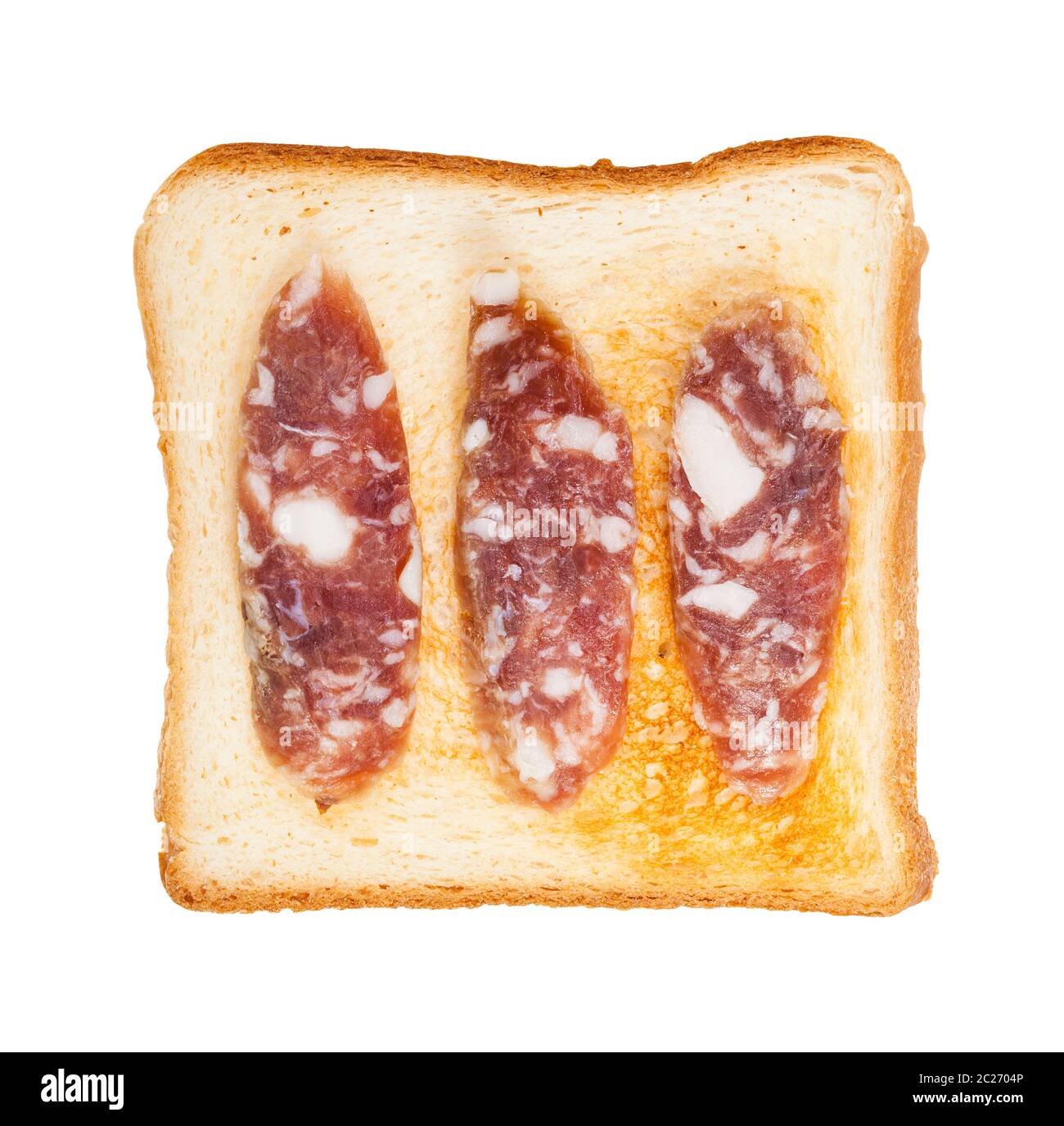 top view of open sandwich with toast and three slices of cured sausage ...