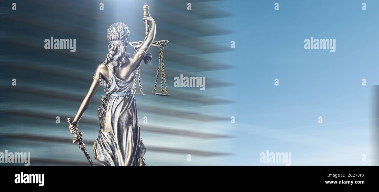 Statue of lady justice on dark background - rear view with copy space ...