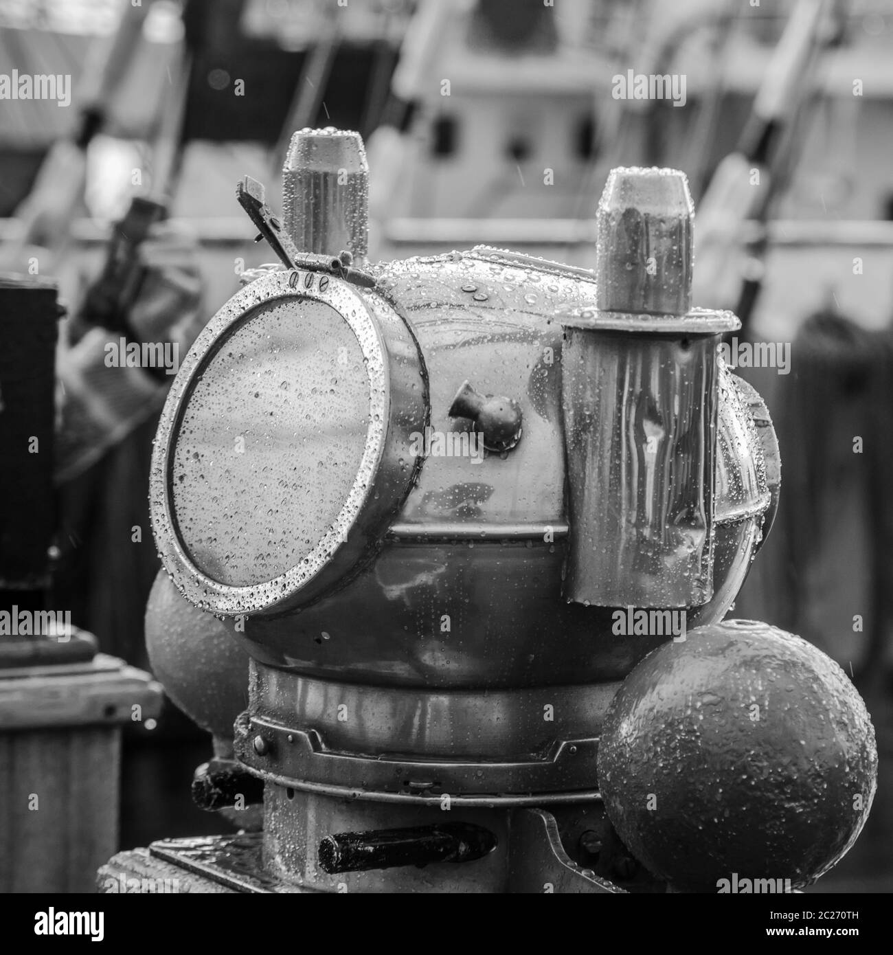 Reflection of a mast in an old ship compass, closeup. Black and white ...