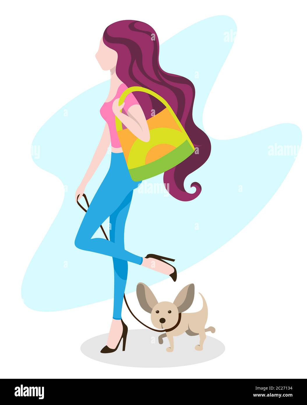 Fashionable slender girl with a bag on his shoulder walks with a small ...