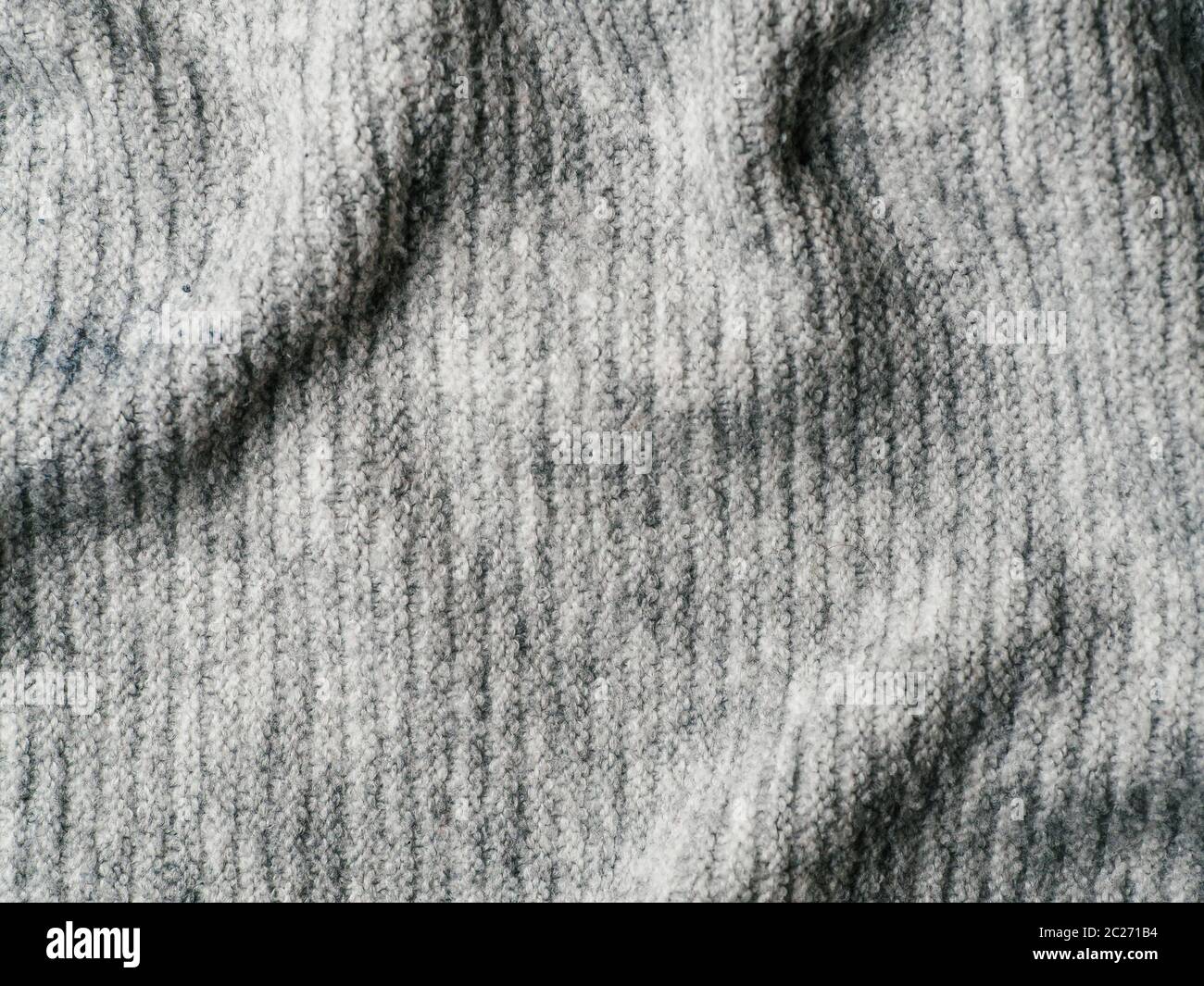 Gray sweater fabric texture. Clothes sweater background with folds ...