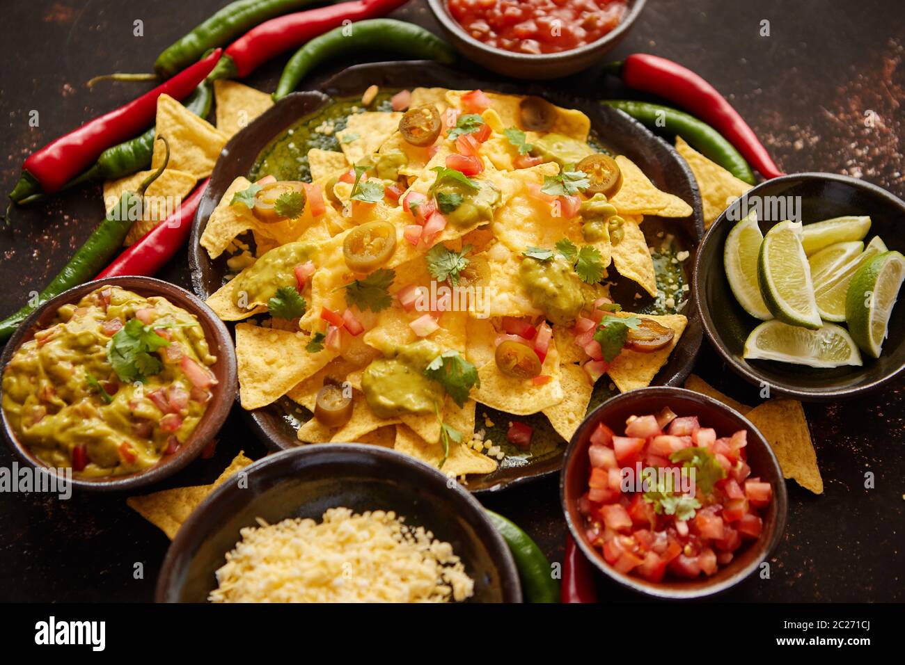 Fresh yellow corn nacho chips on ceramic plate Stock Photo - Alamy