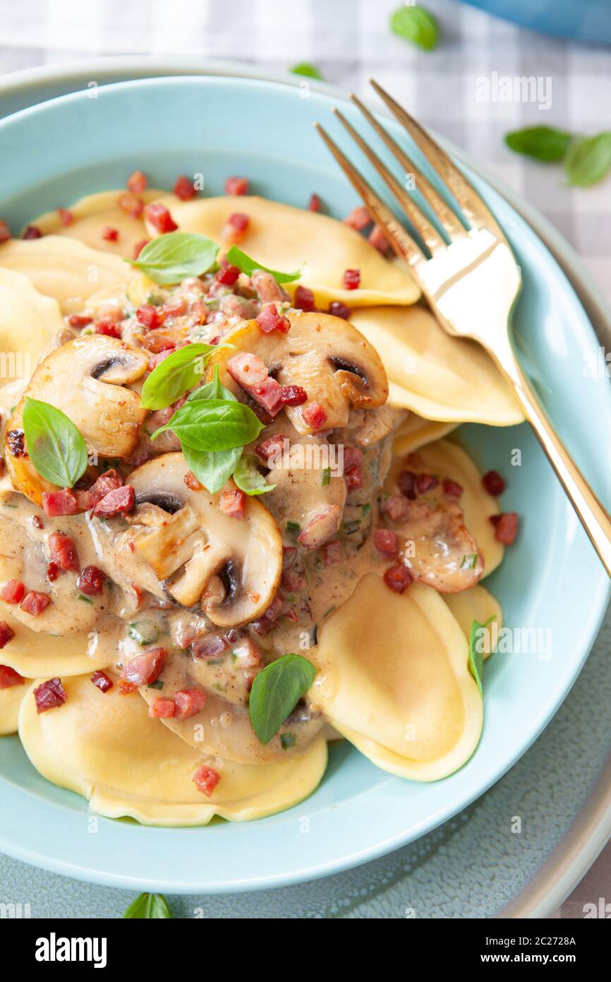 Italian tortelli pasta with a creamy mushroom sauce Stock Photo - Alamy
