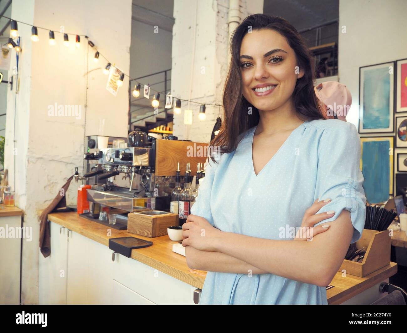 Smiling female barista hi-res stock photography and images - Alamy
