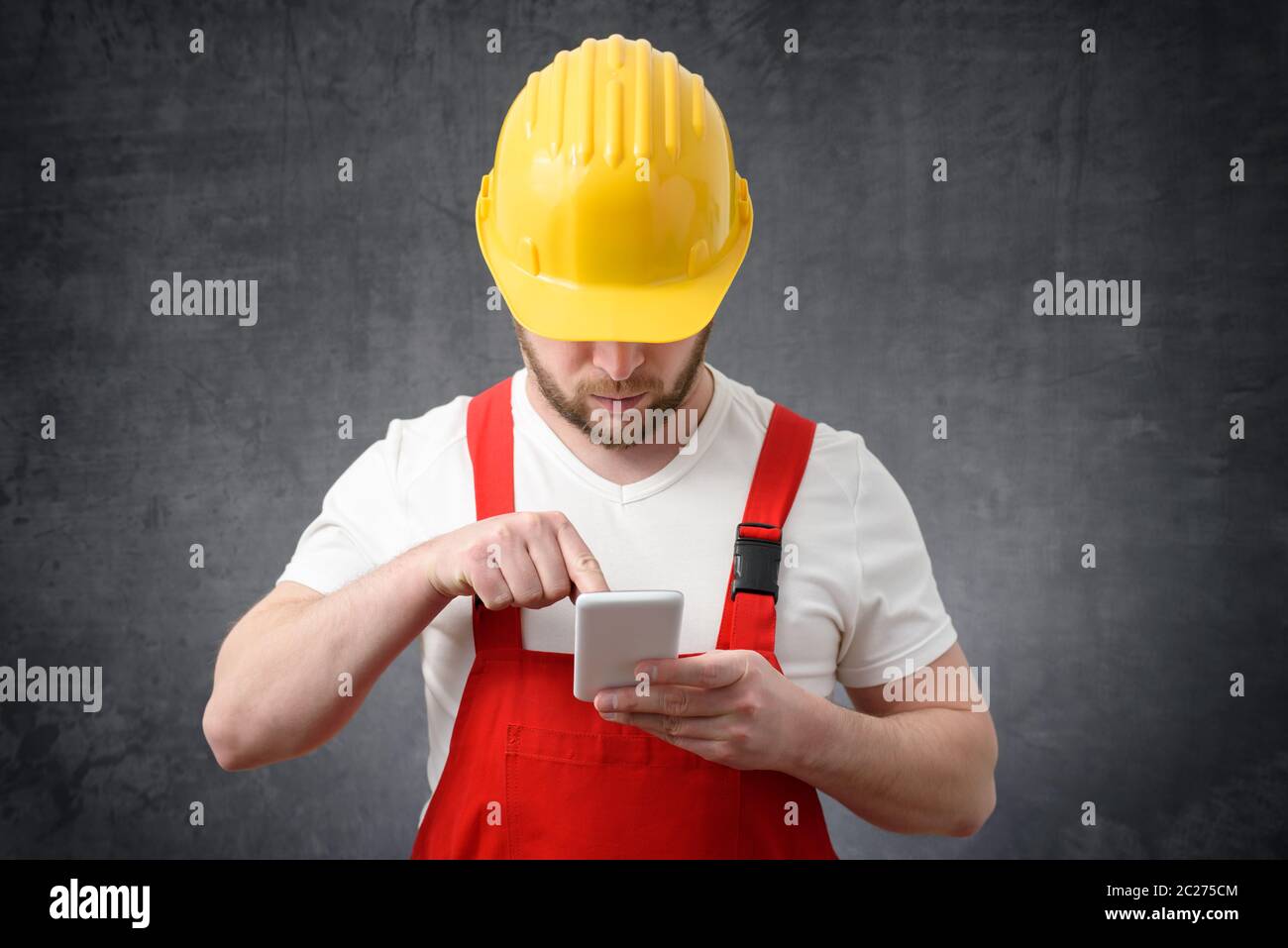 Construction worker using cell hi-res stock photography and images - Alamy