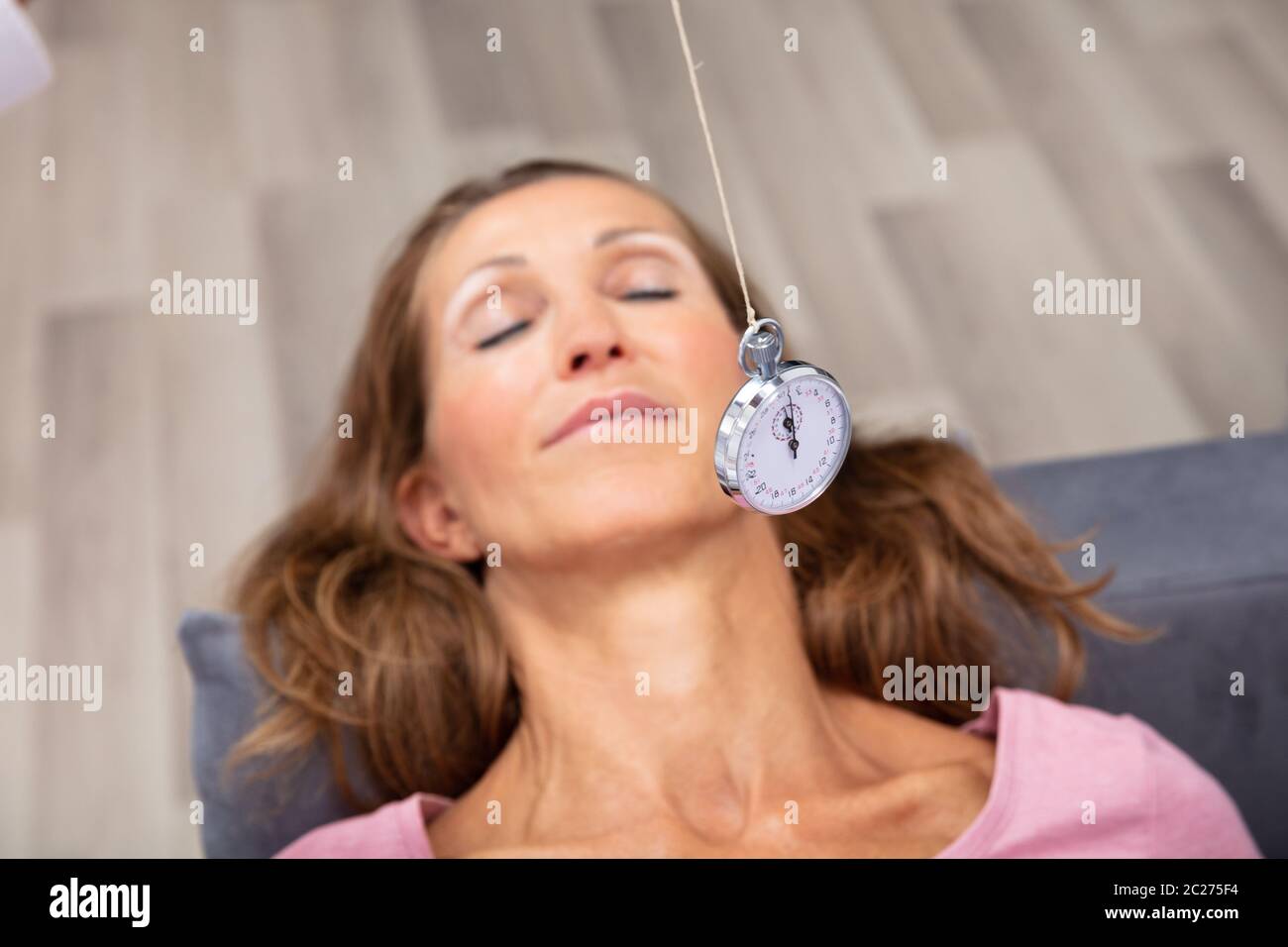 Hypnosis woman watch hi-res stock photography and images - Alamy