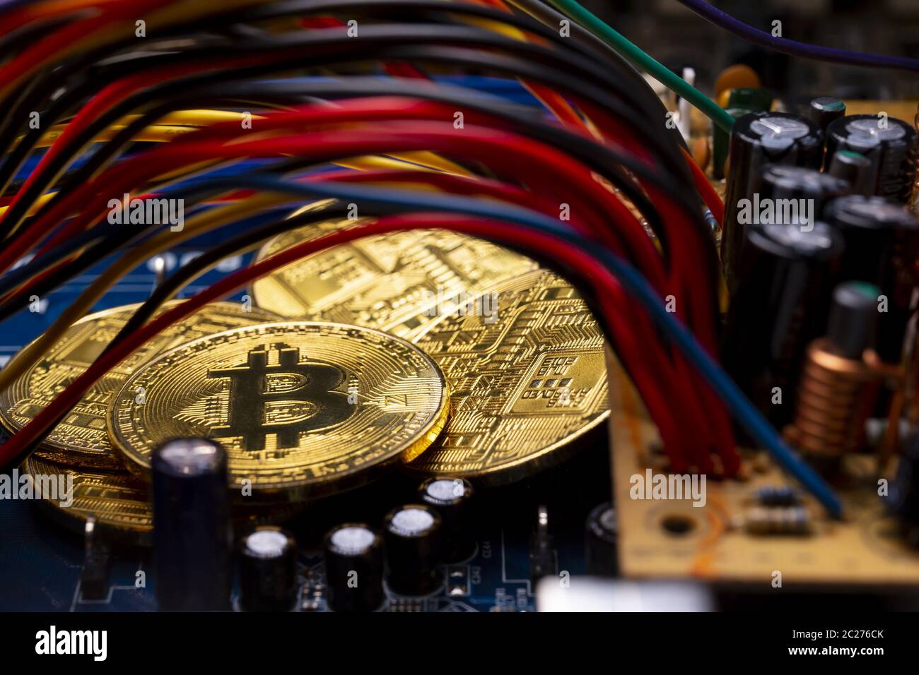 Bitcoin coins, colorful cables and printed circuit board PCB Stock ...