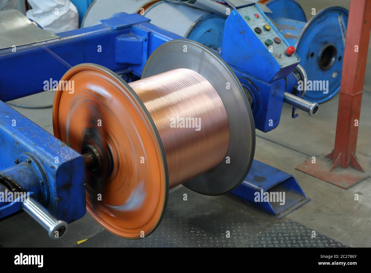 Massive industrial bobbins with twisted copper wire Stock Photo - Alamy