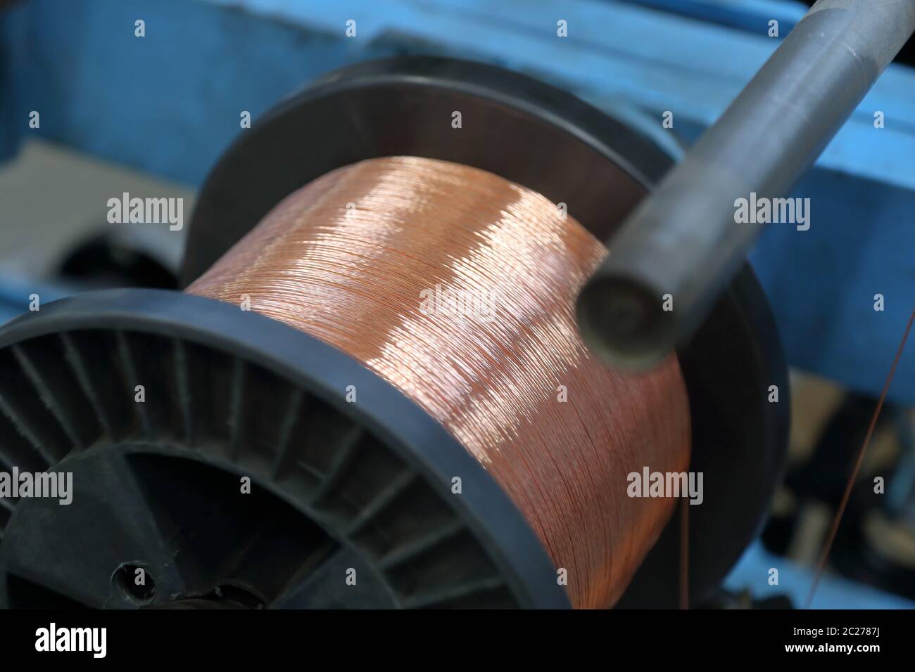 Massive industrial bobbins with twisted copper wire Stock Photo - Alamy