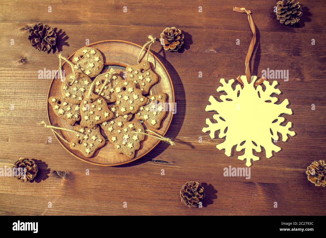 Christmas theme with cookies, spruce cones on a dark background. Flat ...