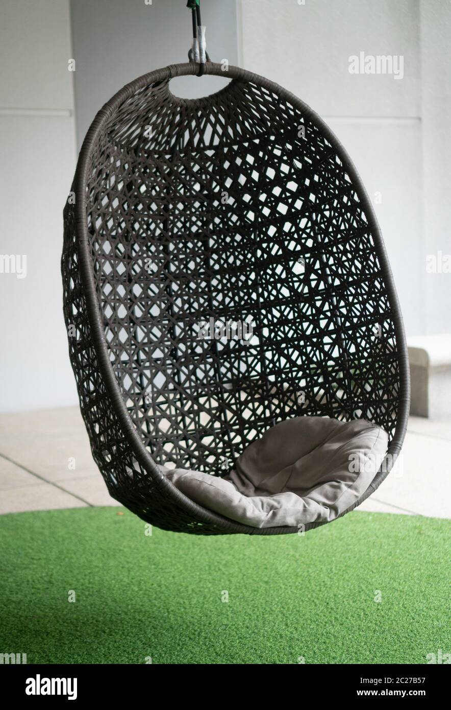Empty modern nest chair indoors Stock Photo - Alamy