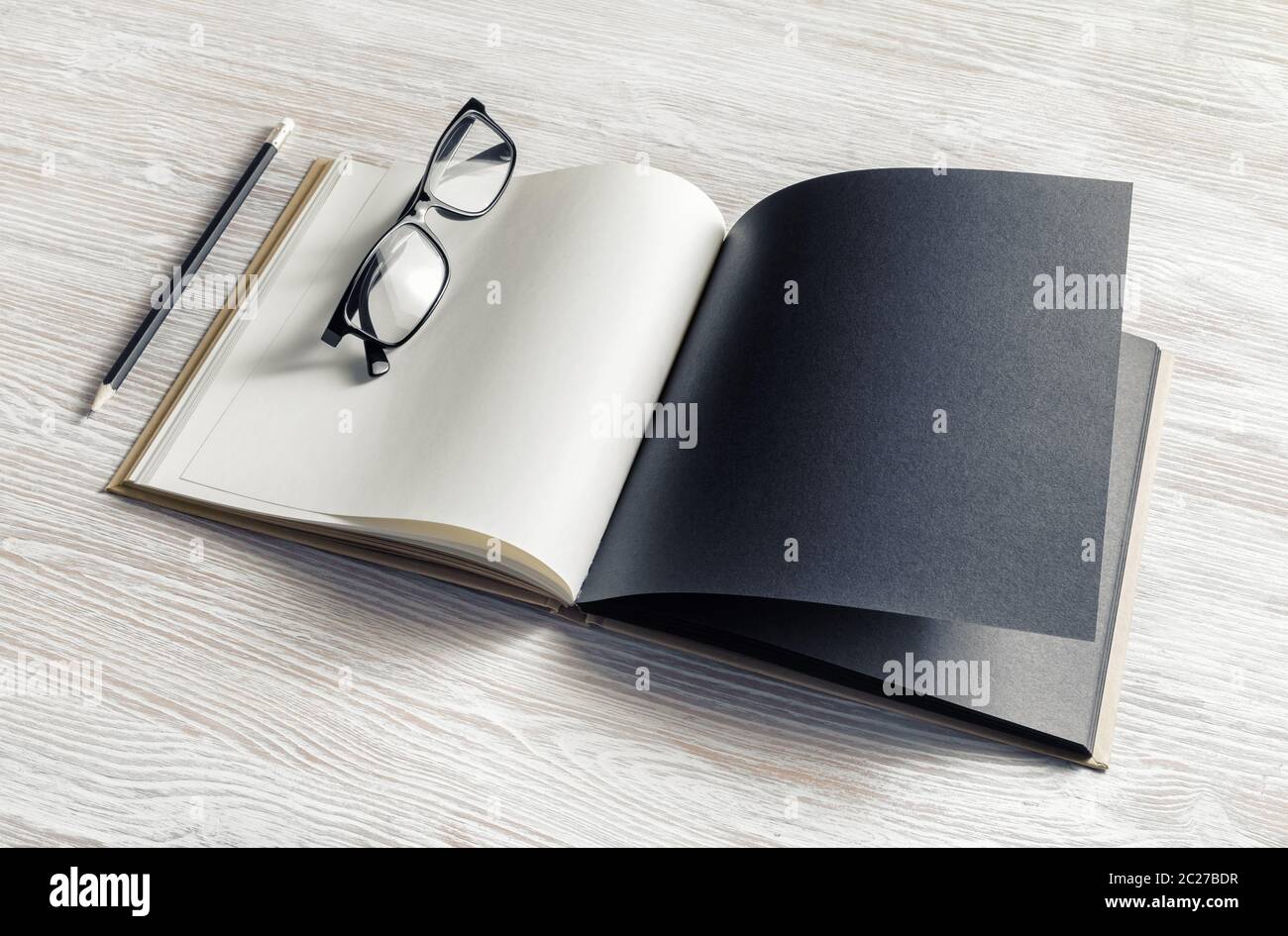 Booklet, glasses, pencil Stock Photo - Alamy