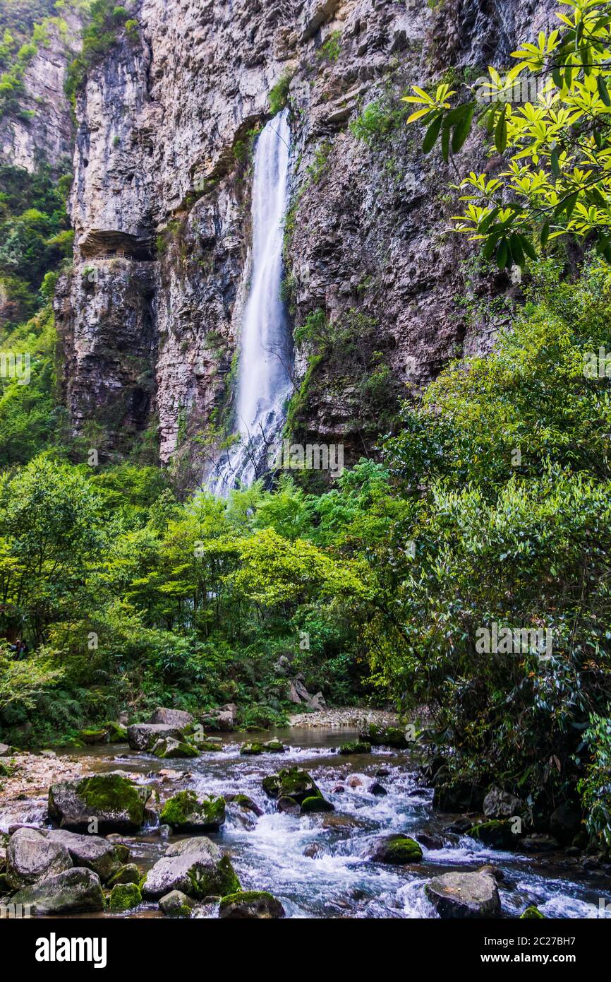 High waterfall falling down from narrow cave in Zhangjiajie in Grand ...