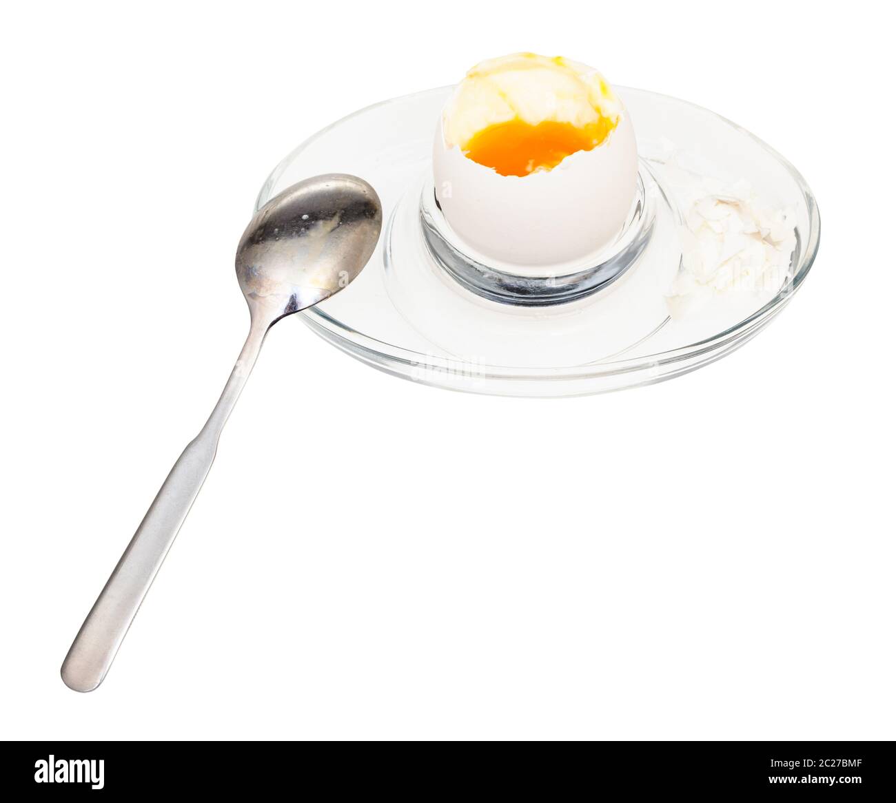 open soft-boiled white egg and spoon in glass egg cup isolated on white ...