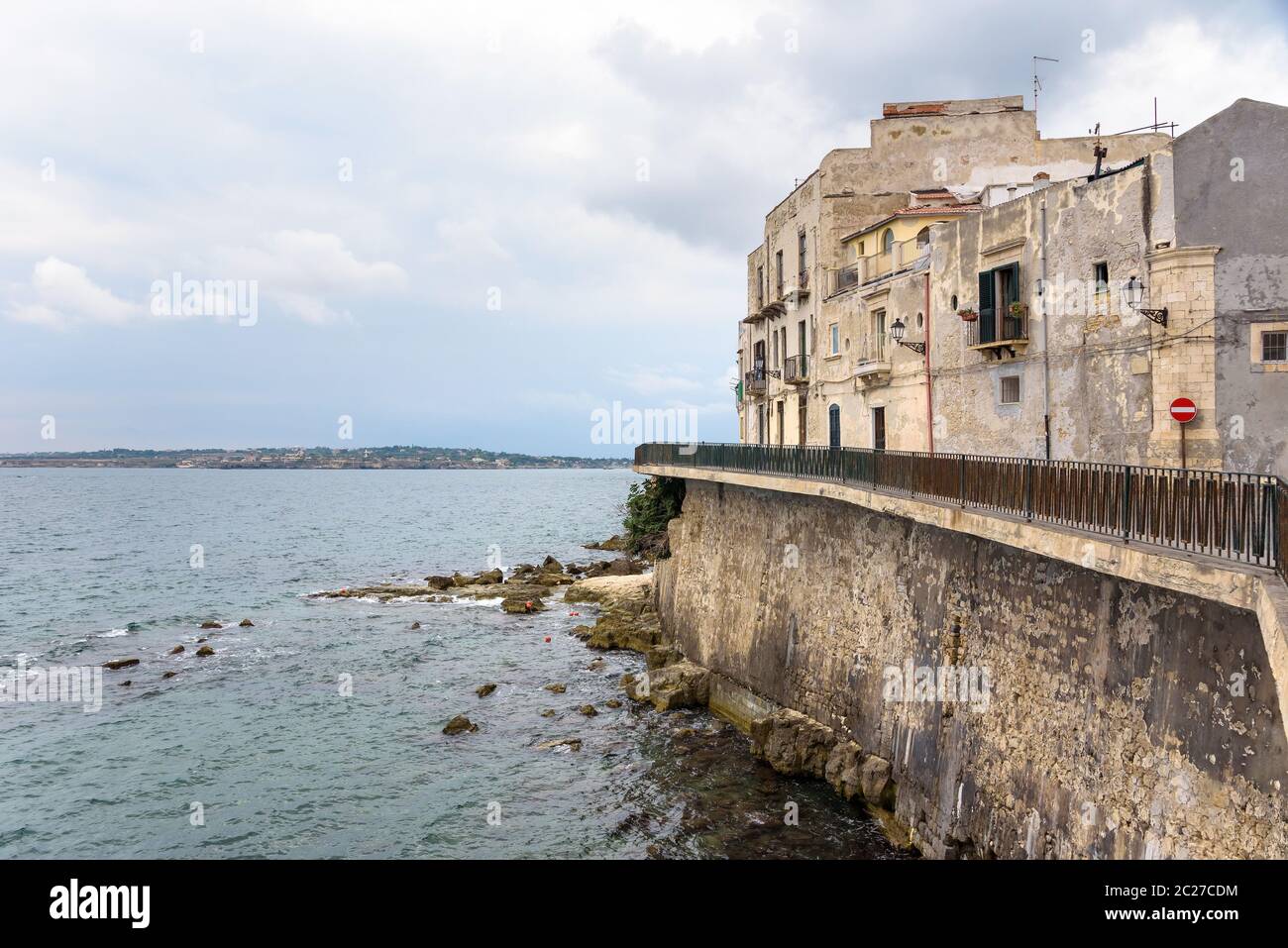 Waterfront with small pebble beach on Ortygia Island in Syracuse ...
