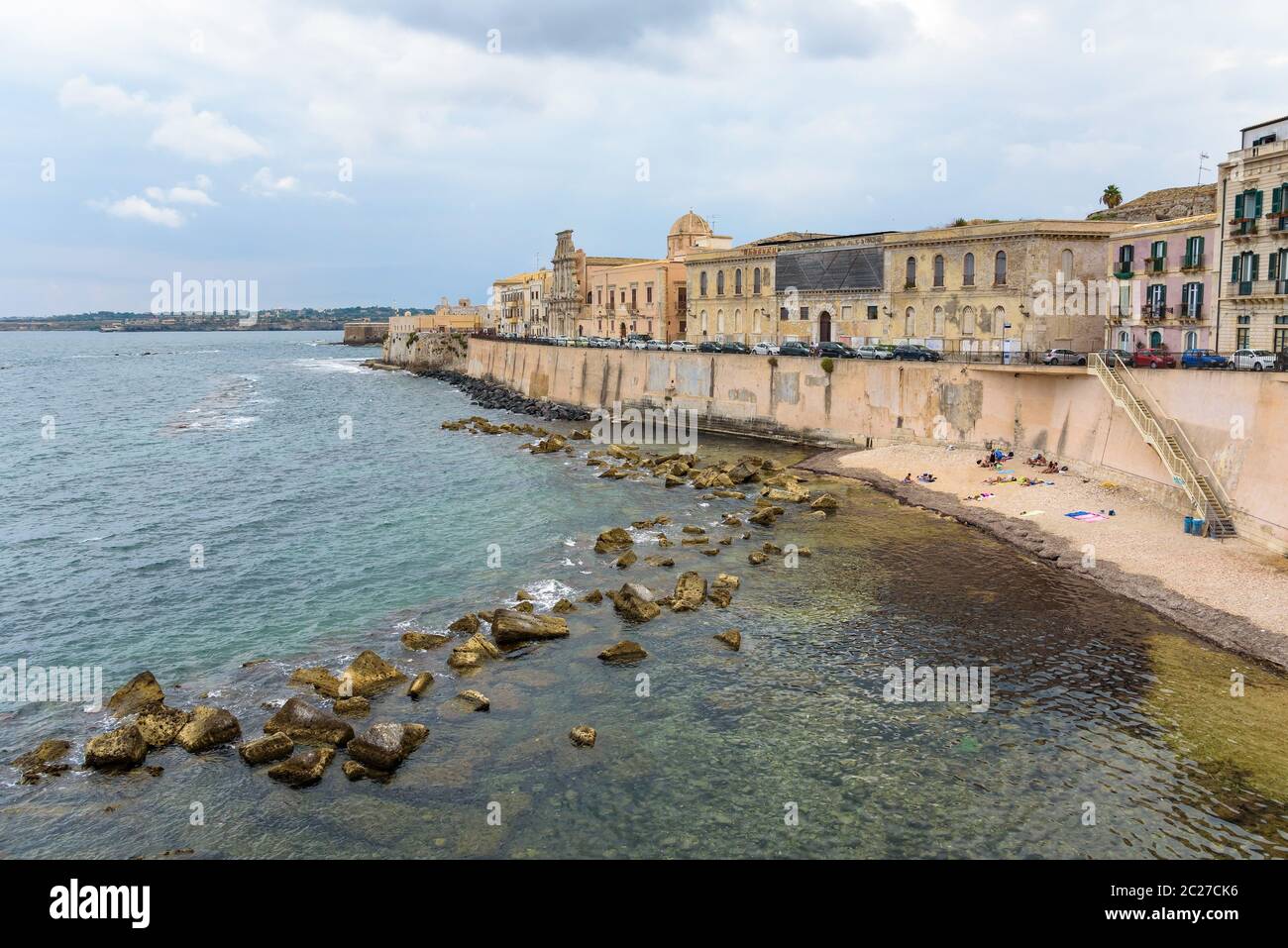 Waterfront with small pebble beach on Ortygia Island in Syracuse ...