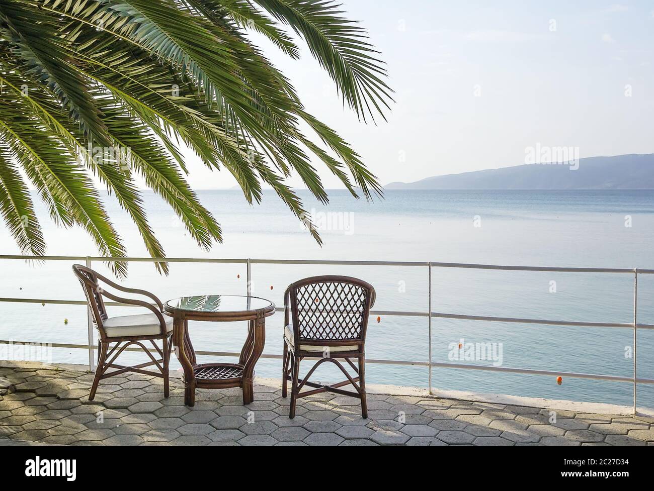 table and chairs overlooking the sea Stock Photo - Alamy