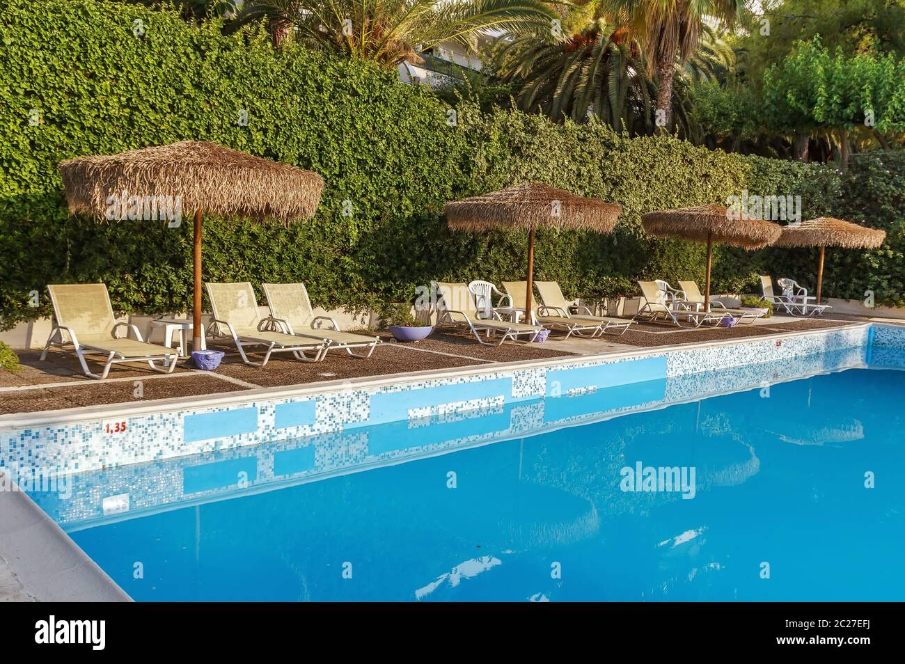 Swimming pool area of hotel Stock Photo - Alamy