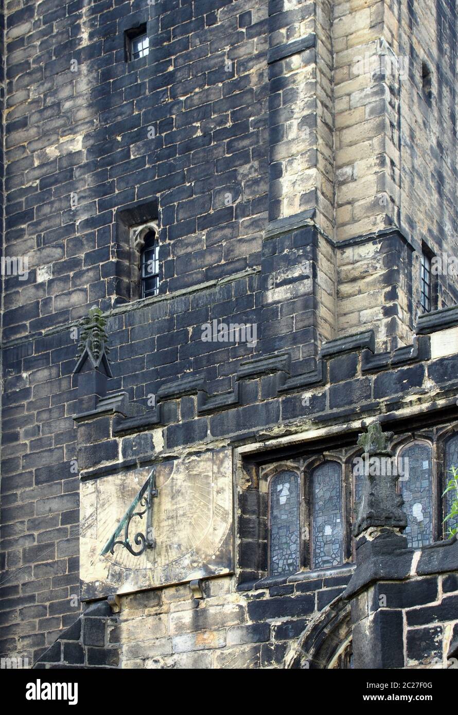 a full frame close up of ancient stonework stained glass windows and a ...