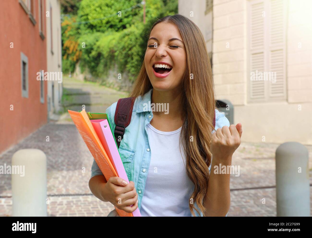 Excited female student celebrating the end of the school year Stock ...