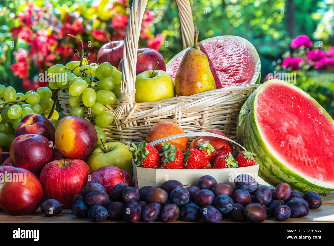 Variety of fresh ripe fruits in the garden. Balanced diet Stock Photo ...
