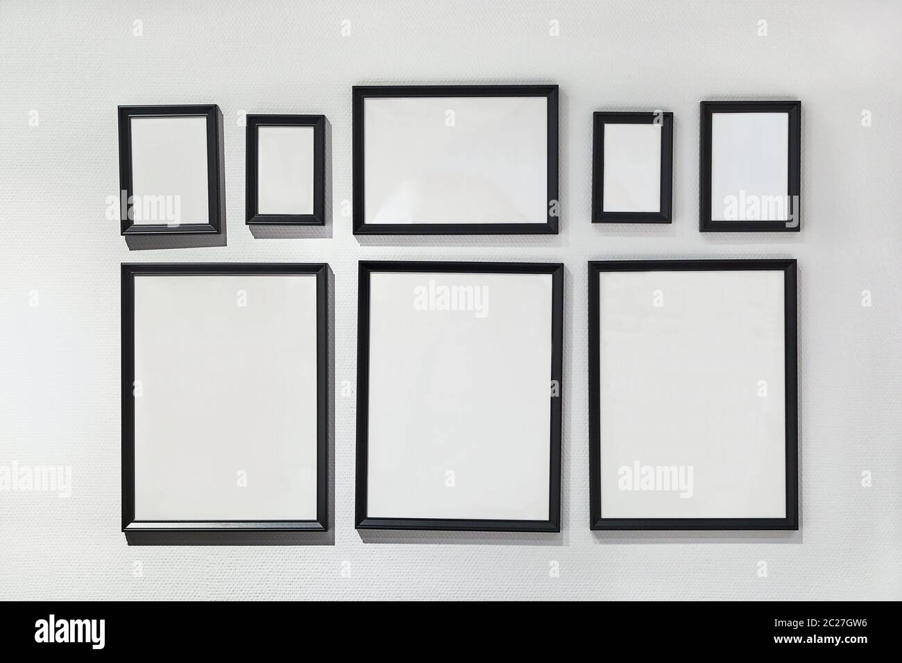 Set of empty picture frames on a wall in different sizes Stock Photo ...