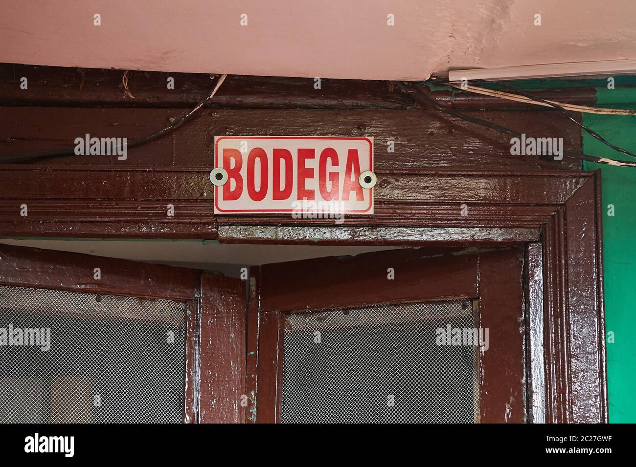 Sign Bodega over door, Spanish word meaning warehouse of strorage room ...