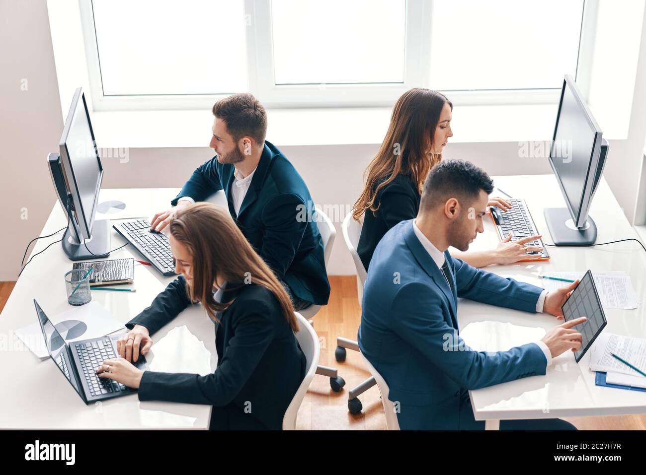 Top view of business people working on computer in modern office Stock ...