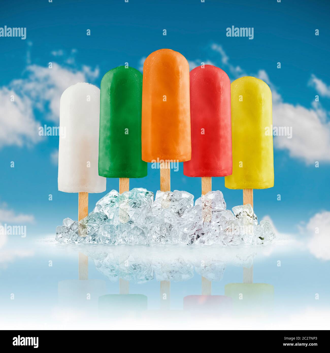 variety of fruits popsicle on ice cube with sky background Stock Photo ...