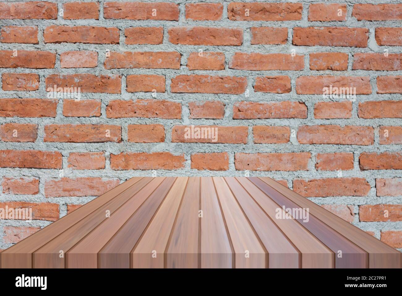 Brown table top on brick wall. For product display Stock Photo - Alamy