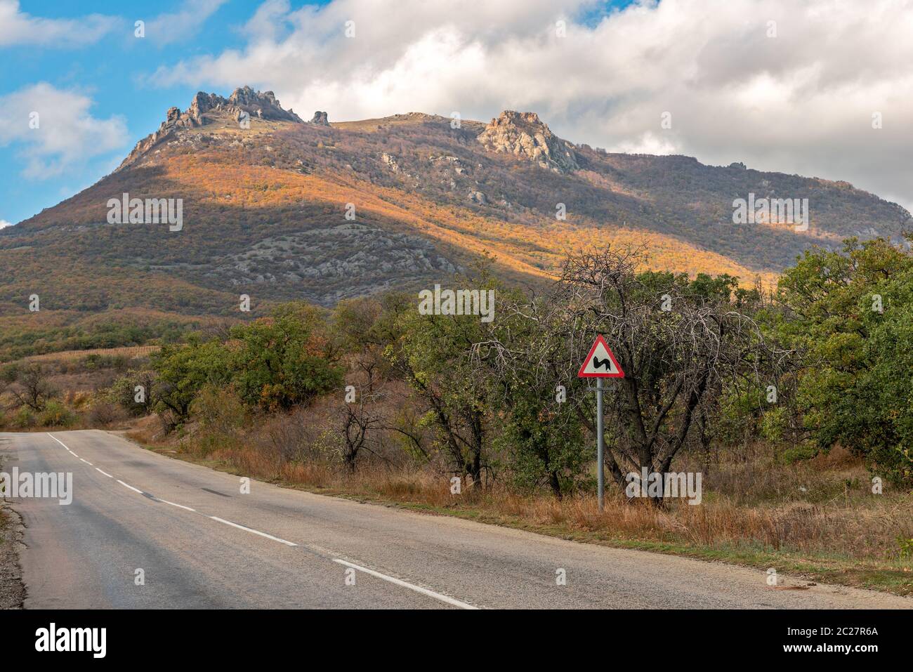 Road sign on mountain road Stock Photo - Alamy