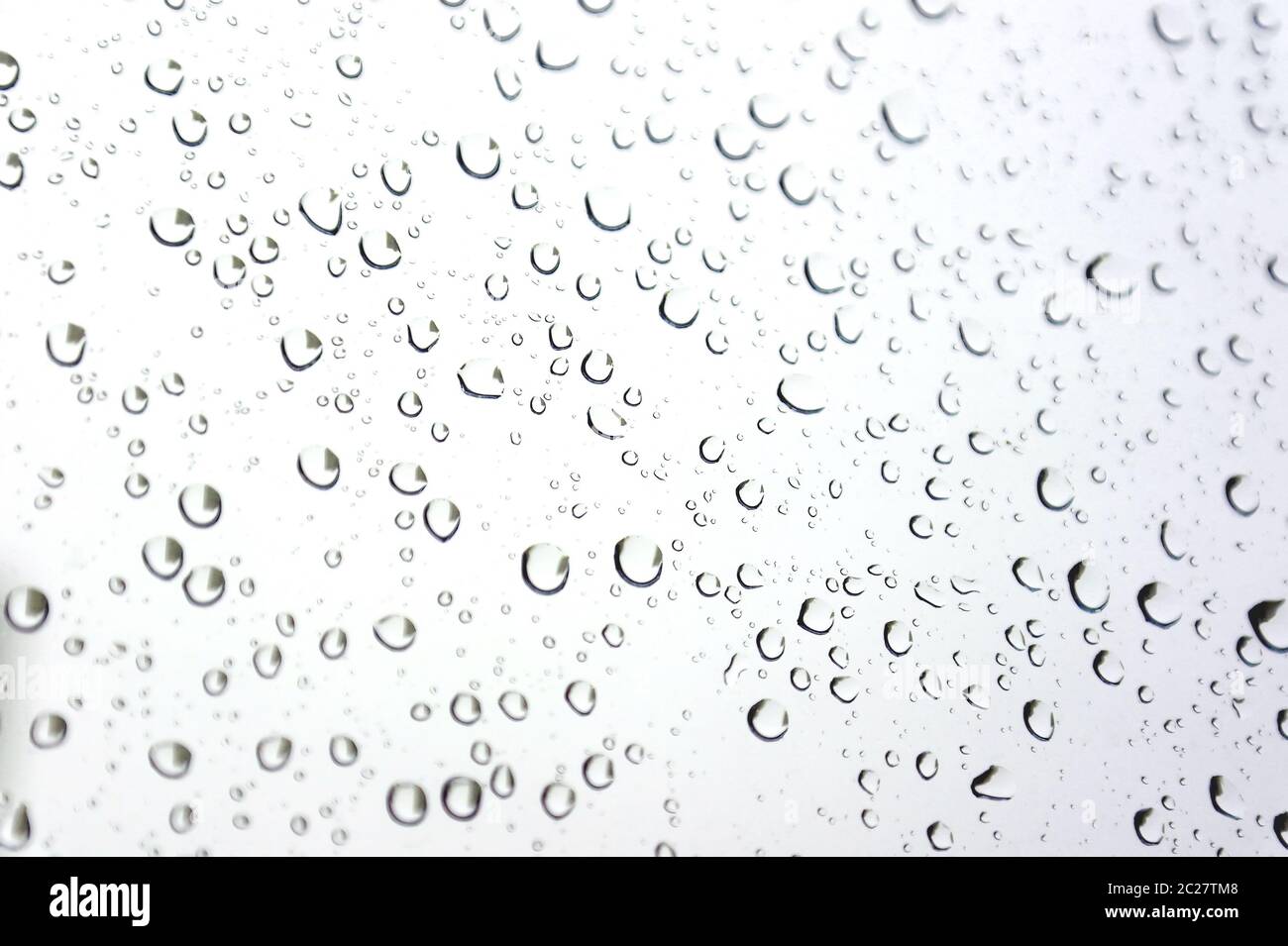 Drops of rain on the inclined window (glass). Shallow DOF Stock Photo ...