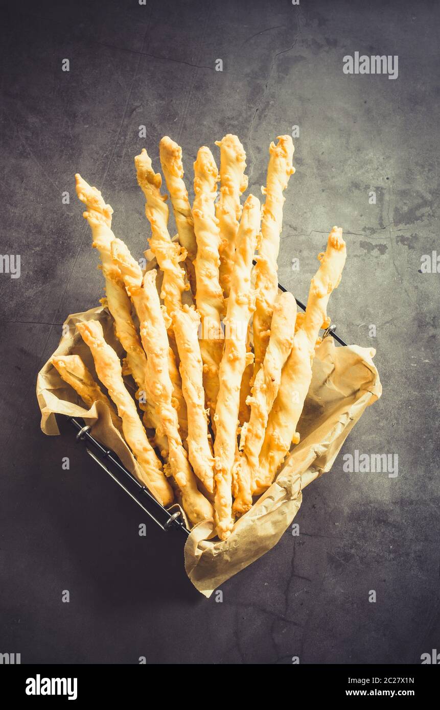Cheese stick. Breadsticks with cheese on dark background, concept for ...