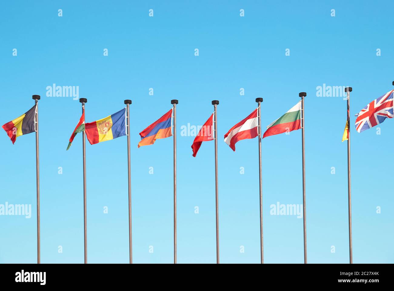 Row of european flags against blue sky background Stock Photo - Alamy