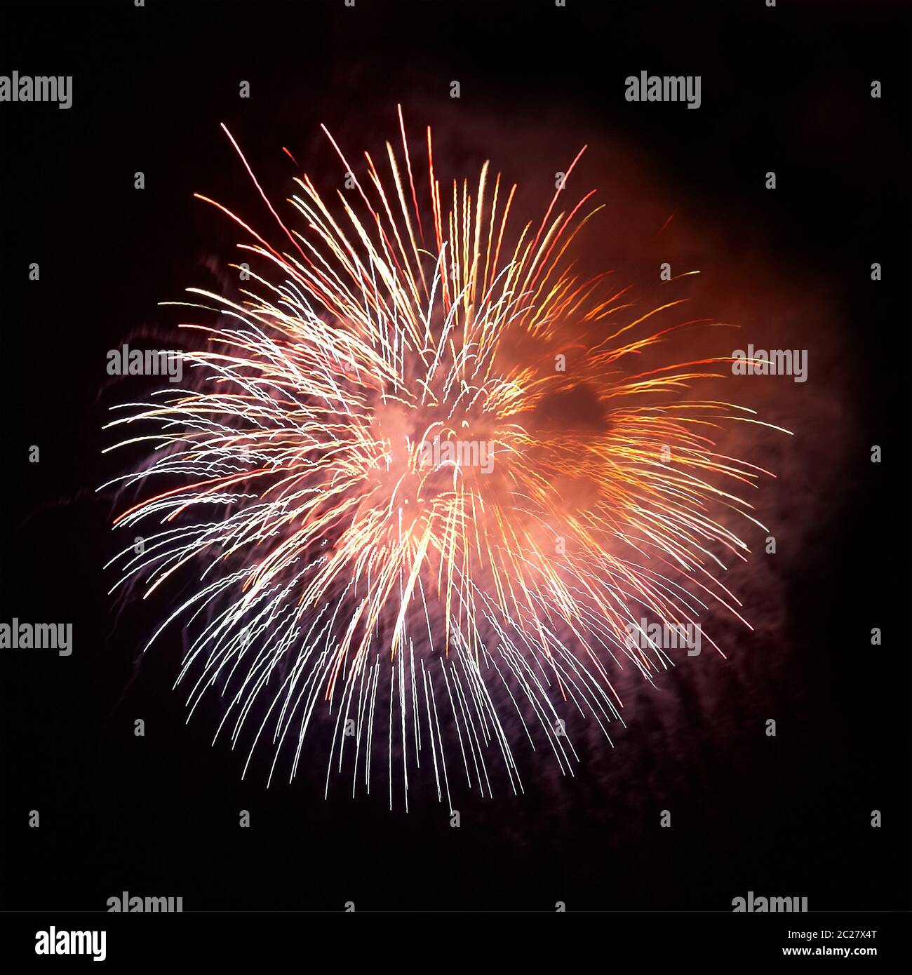 Red colorful fireworks on the black sky background. Holiday celebration ...