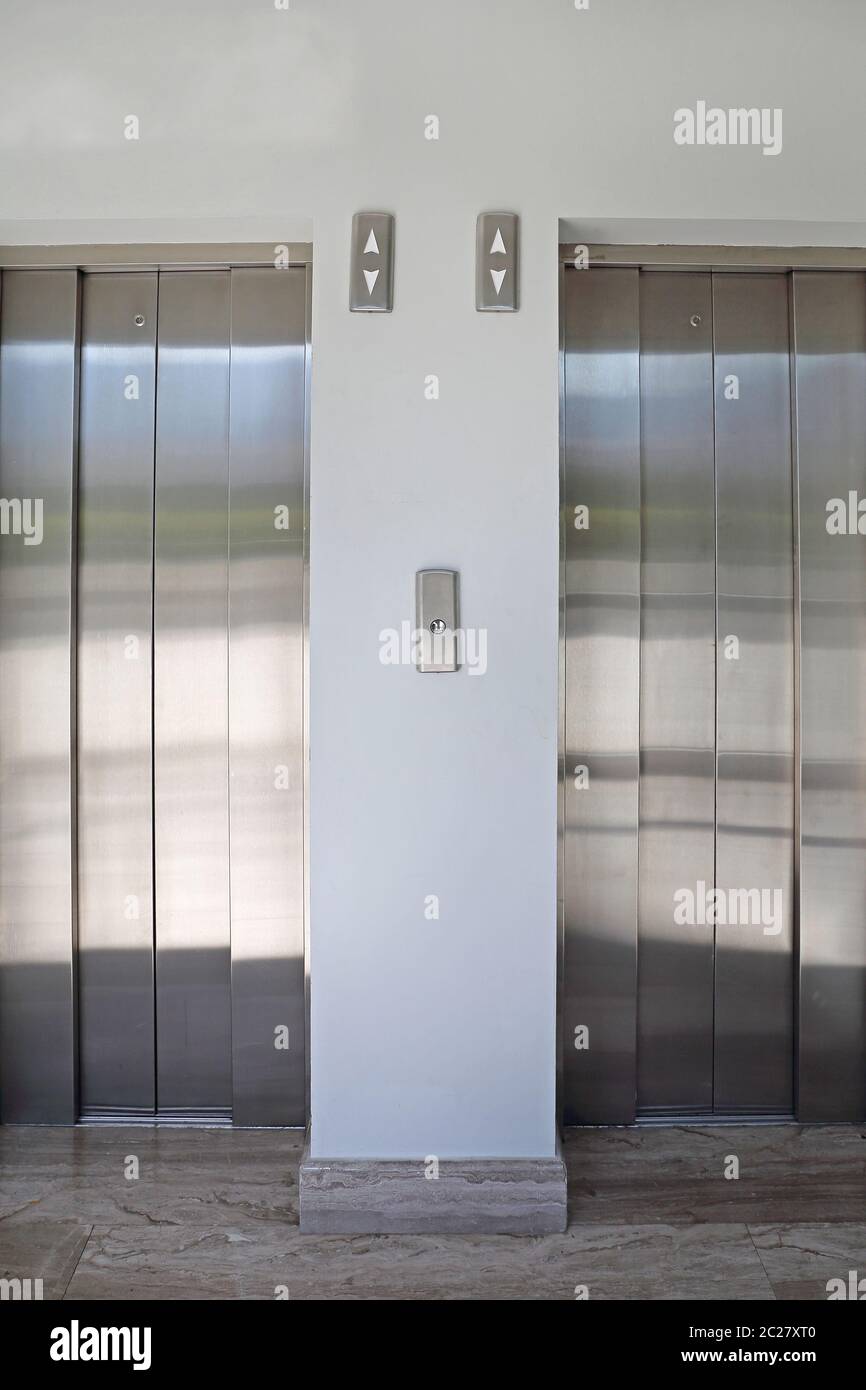Closed Elevators Doors at Two Modern Lifts Stock Photo - Alamy