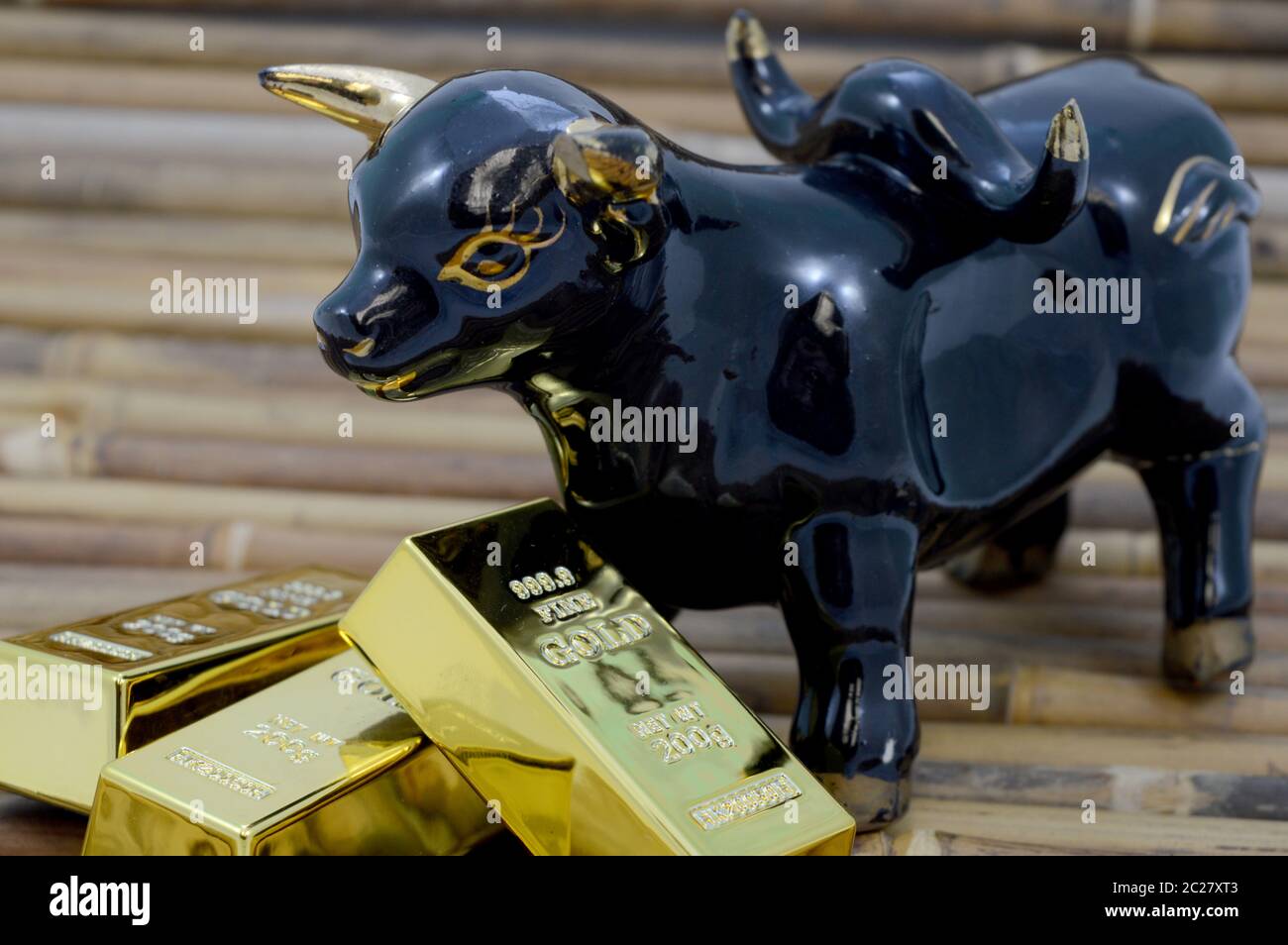 A bull and gold bullion to showcase the rise of the stock market Stock ...