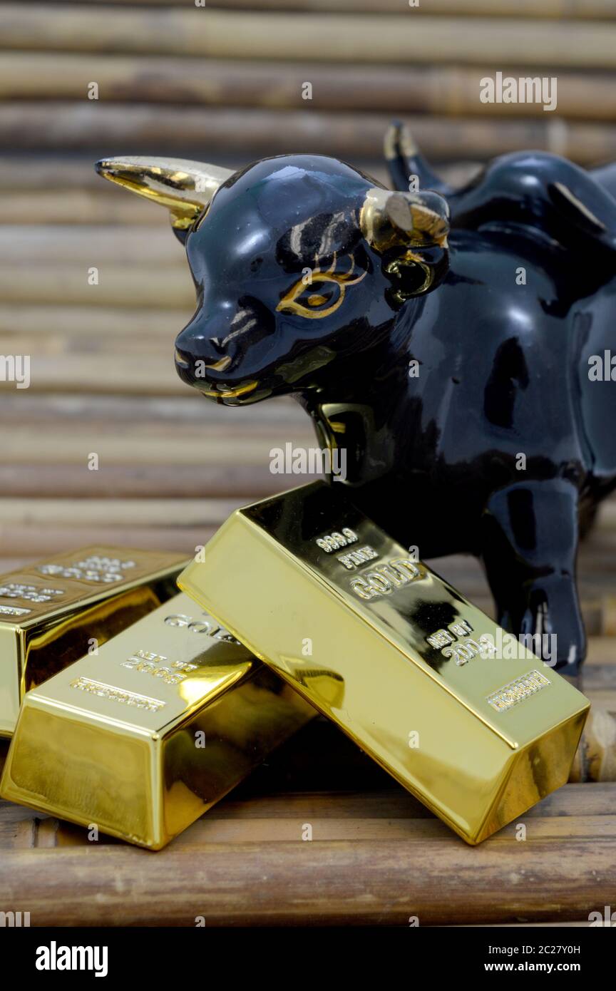A bull and gold bullion to showcase the rise of the stock market Stock ...