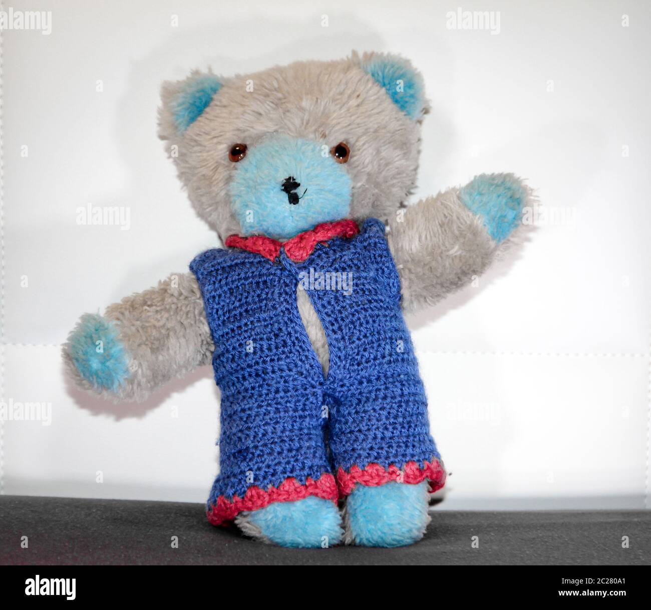 An old gray blue teddy bear Stock Photo - Alamy