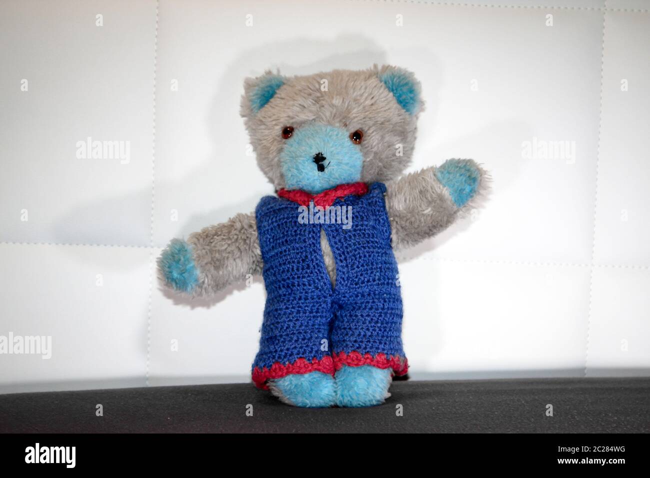 An old gray blue teddy bear Stock Photo - Alamy
