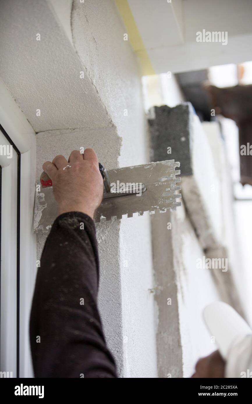 plastering, close up arm Stock Photo - Alamy