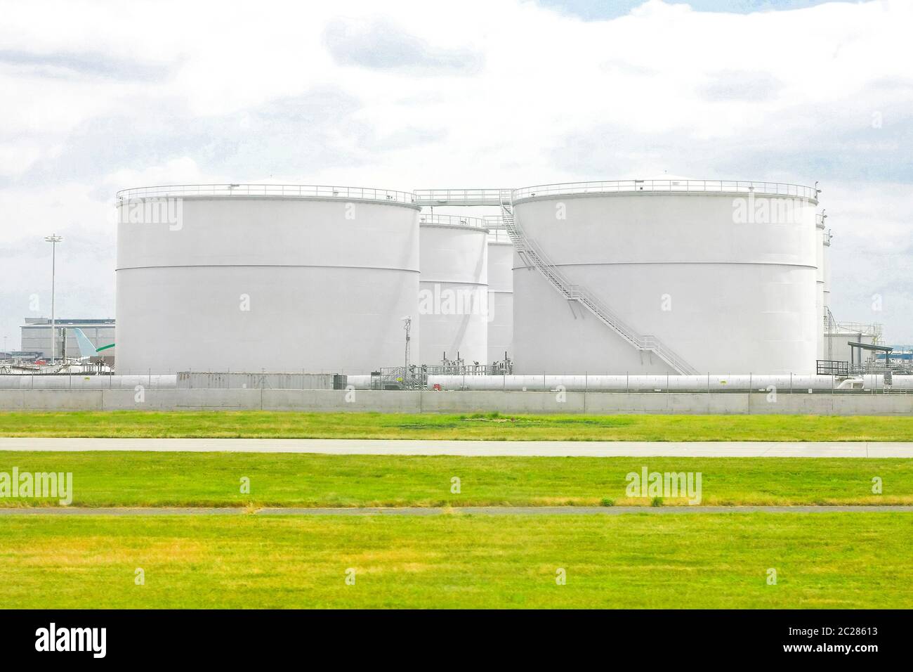 Big White Round Tanks Reservoirs for Fuel Oil Stock Photo - Alamy